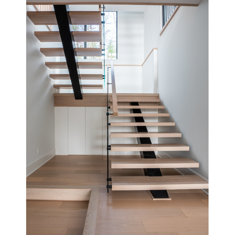 Floating wooden staircase with central steel stringer and glass railing ...